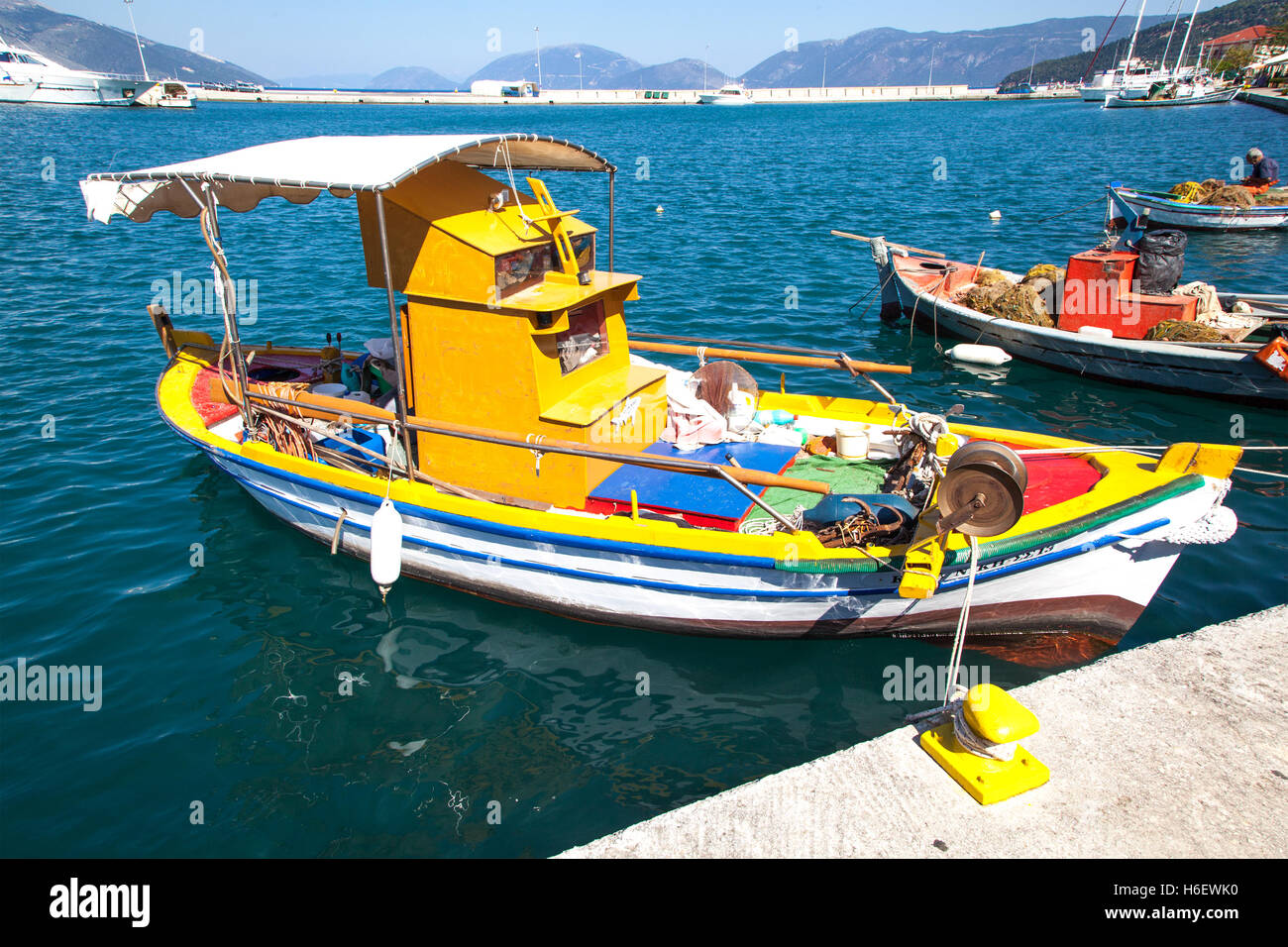 Brightly coloured fishing boat in the harbour at Sami on the Greek ...