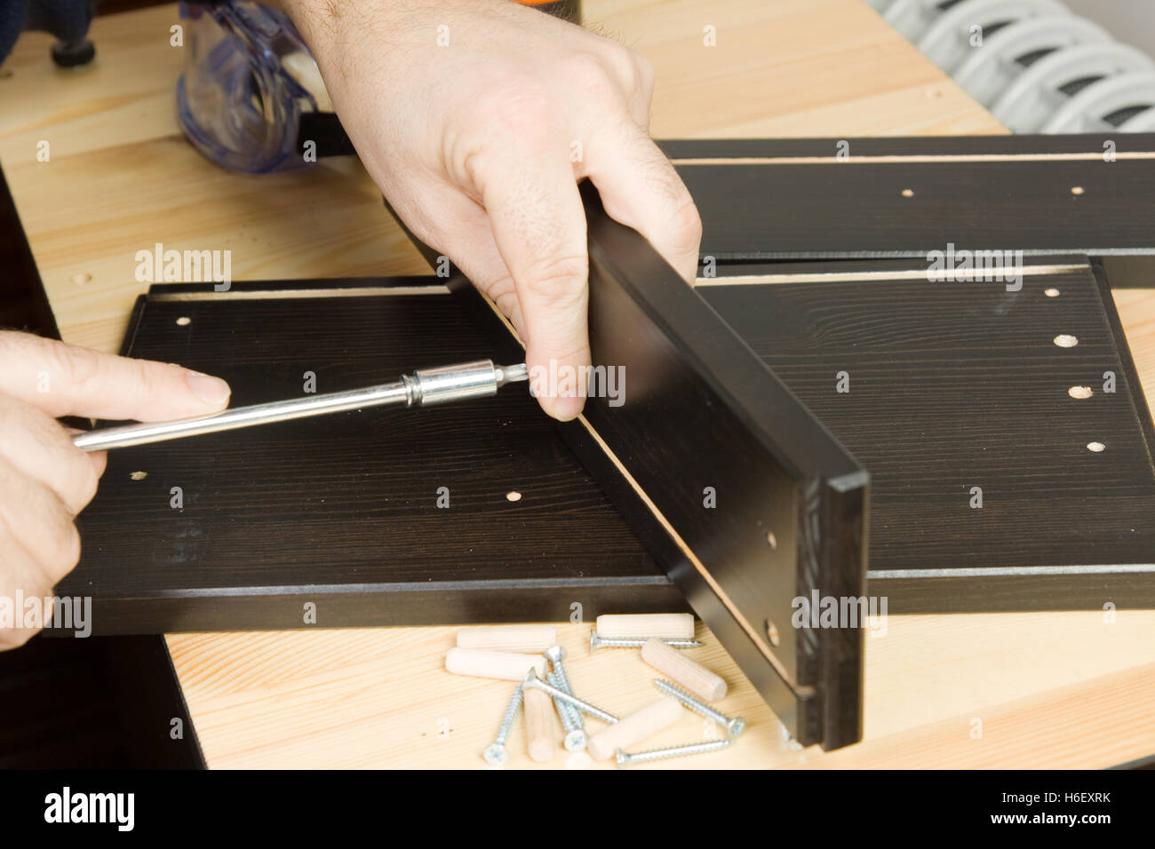 carpenter fitting a piece of furniture in a house Stock Photo - Alamy