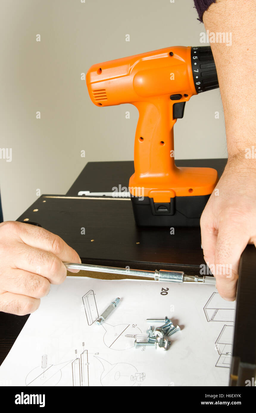 carpenter fitting a piece of furniture in a house Stock Photo - Alamy