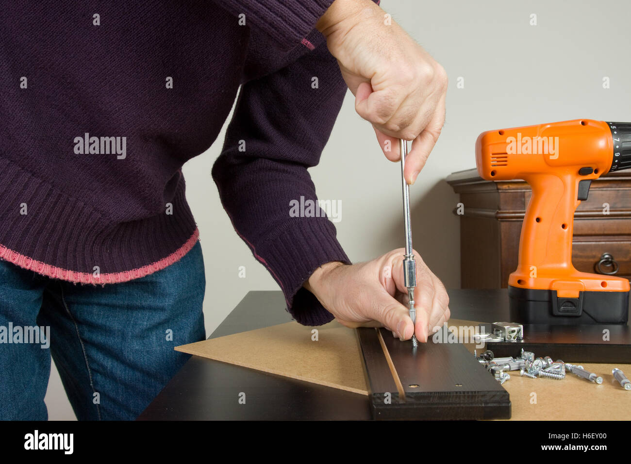 carpenter fitting a piece of furniture in a house Stock Photo - Alamy