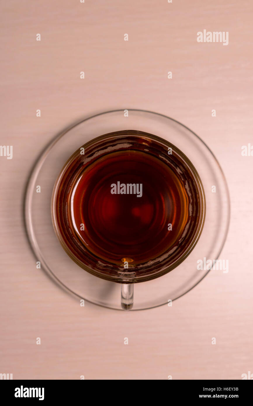 transparent glass cup with tea and saucer top view Stock Photo - Alamy