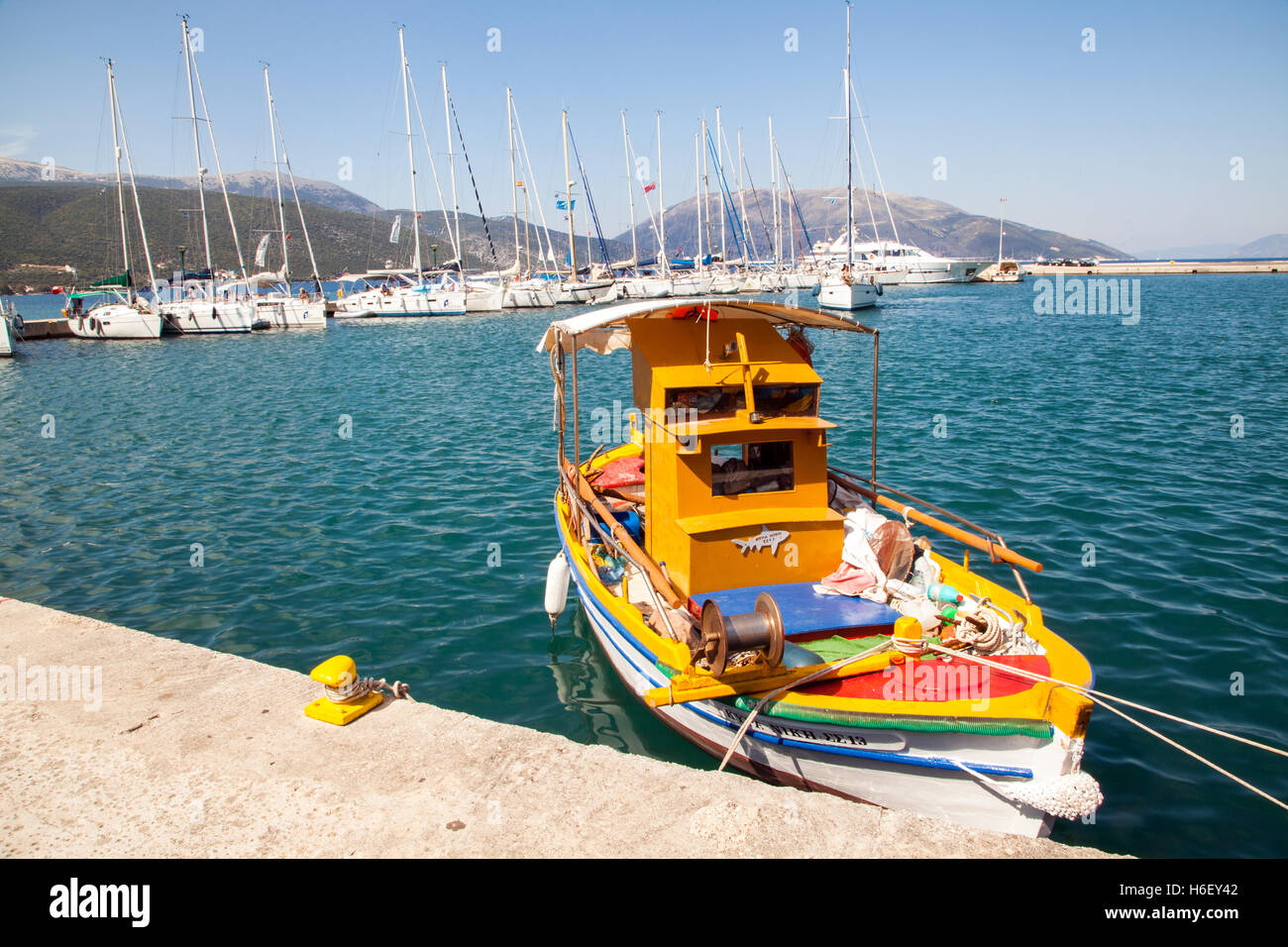 Brightly coloured fishing boat in the harbour at Sami on the Greek ...