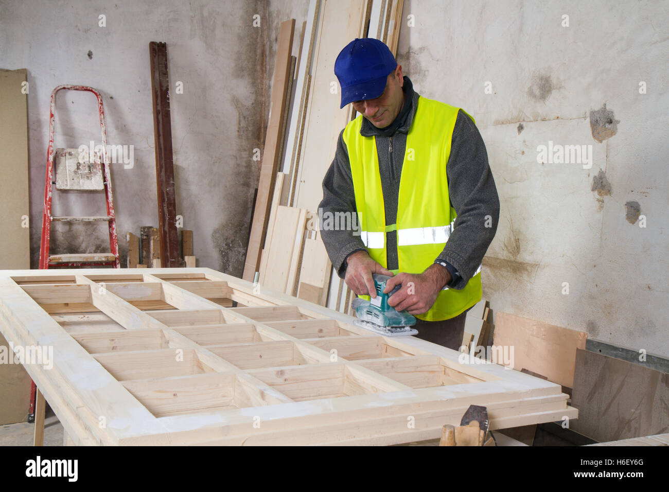 carpenter making a door in a workshop Stock Photo - Alamy