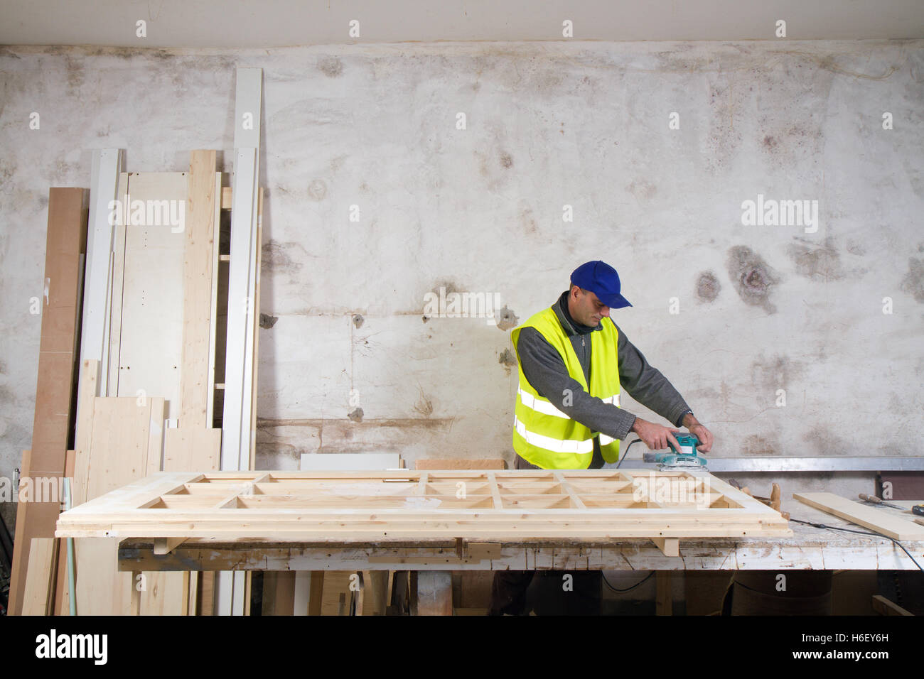 carpenter making a door in a workshop Stock Photo - Alamy