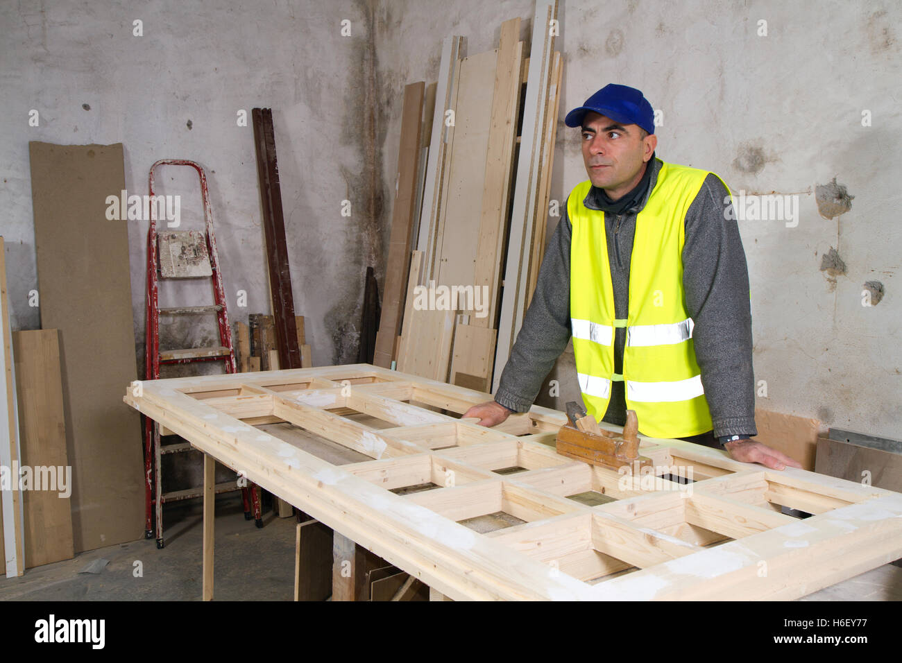carpenter making a door in a workshop Stock Photo - Alamy