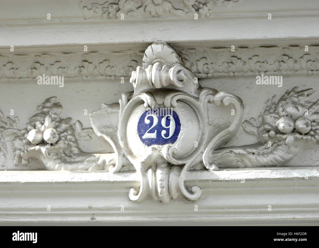 Door number from a historical house in Paris. Blue and white building ...
