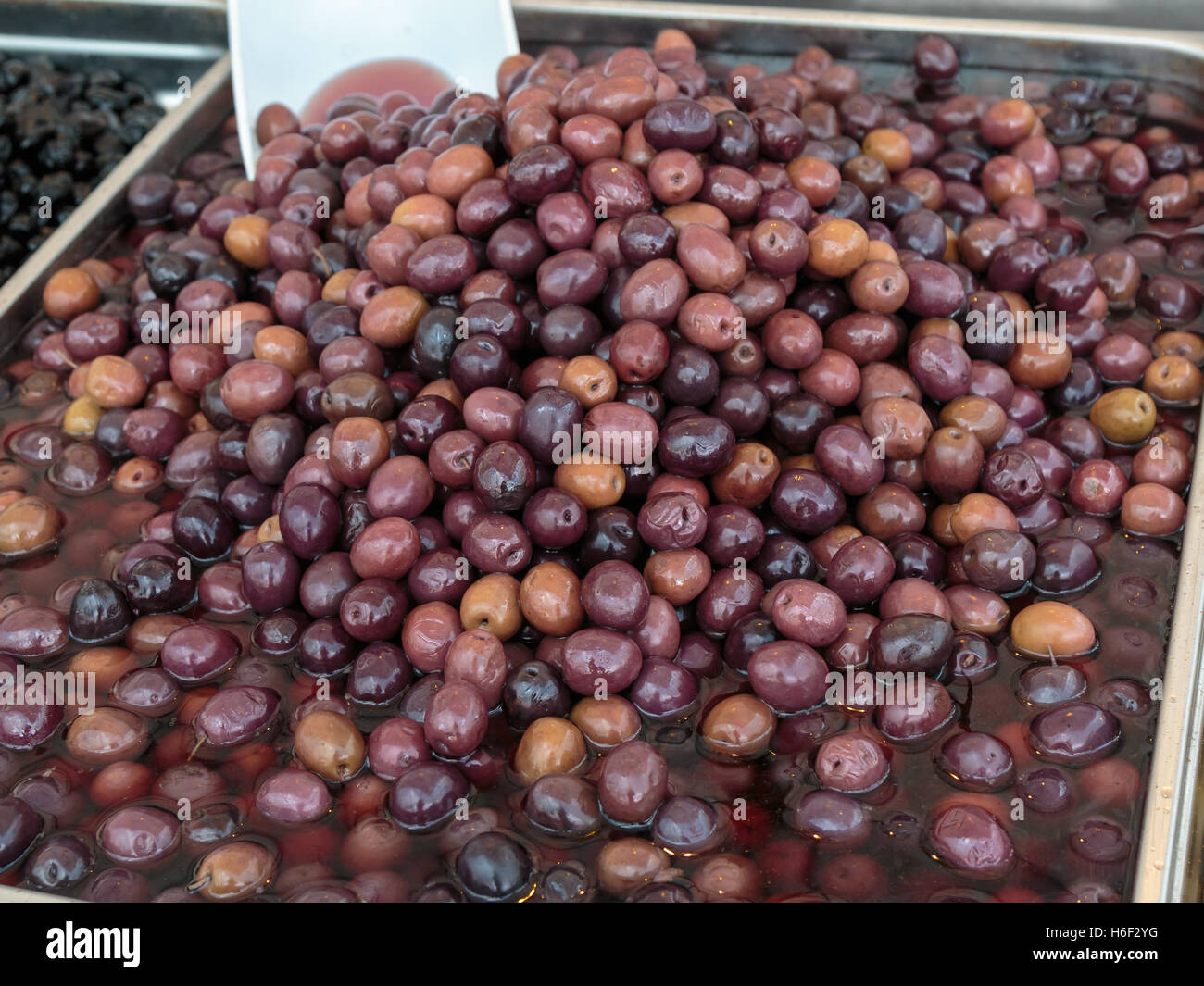 Natural Black Olives inside Metallic Bowl Stock Photo - Alamy
