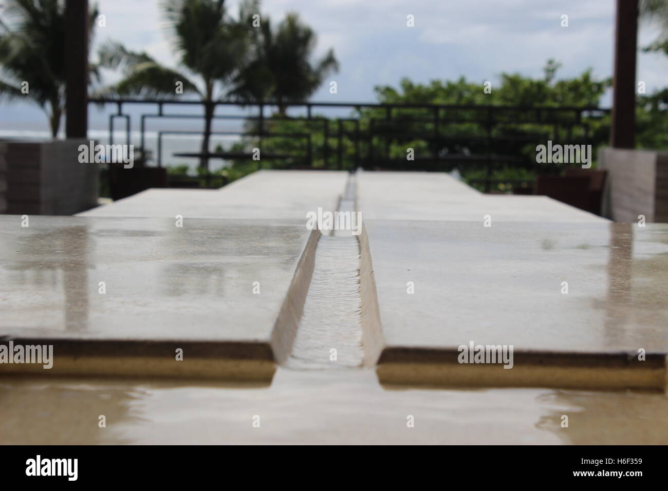Water drain in a tropical atmosphere with beach view Stock Photo - Alamy