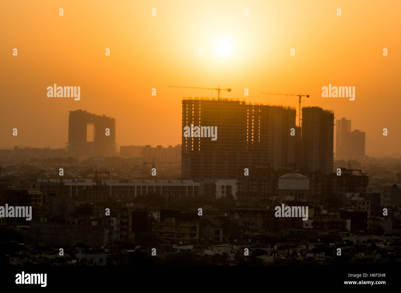 Buildings under construction at dusk Stock Photo - Alamy