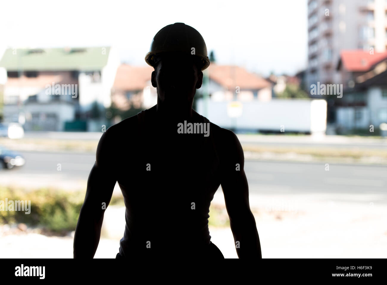 Silhouette Man Construction Worker On Construction Site Stock Photo - Alamy