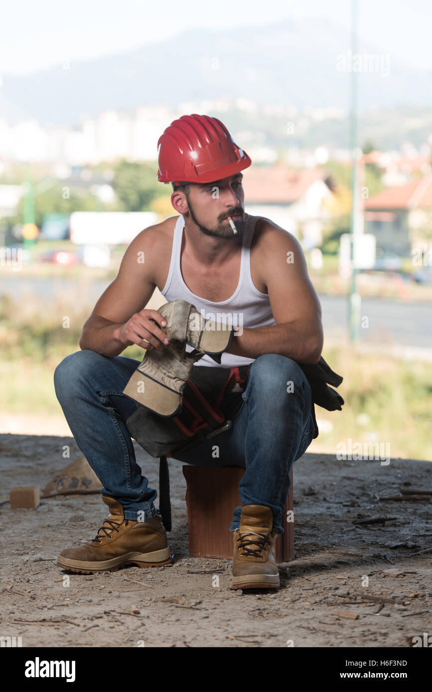 Construction Worker Relaxing The Fresh Air During Work Stock Photo - Alamy