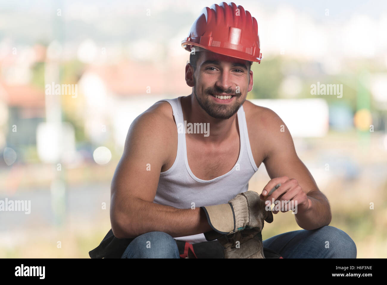 Construction Worker Relaxing The Fresh Air During Work Stock Photo - Alamy