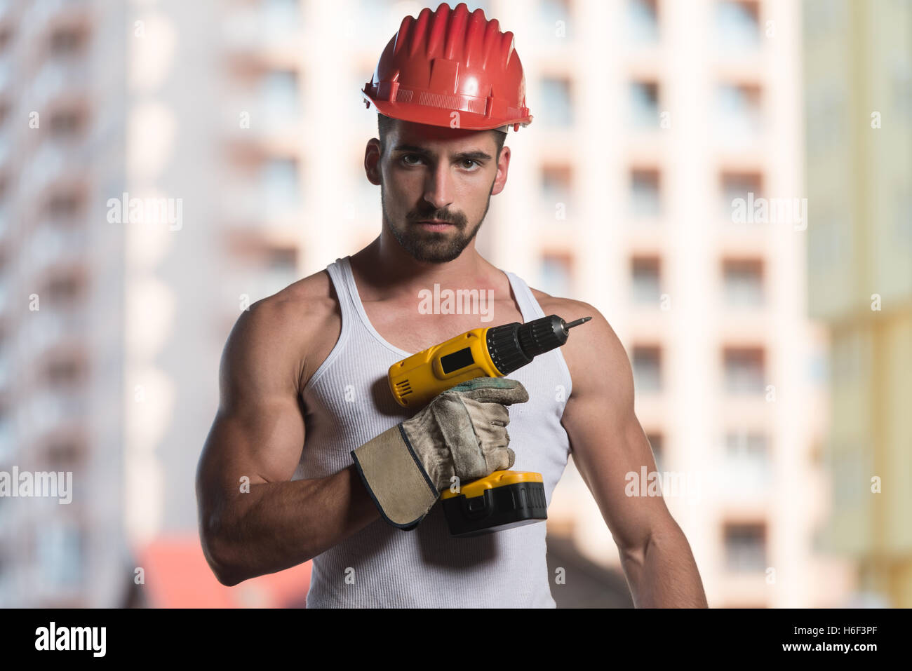 Successful Male Architect At A Building Site With Drill Stock Photo - Alamy
