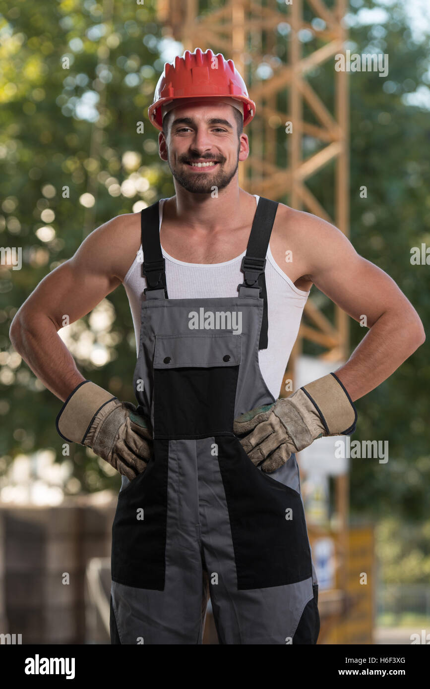 Portrait Of Handsome Male Architect Engineer With Red Helmet Stock ...