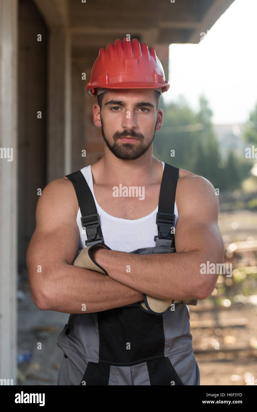 Portrait Of Handsome Male Architect Engineer With Red Helmet Stock ...