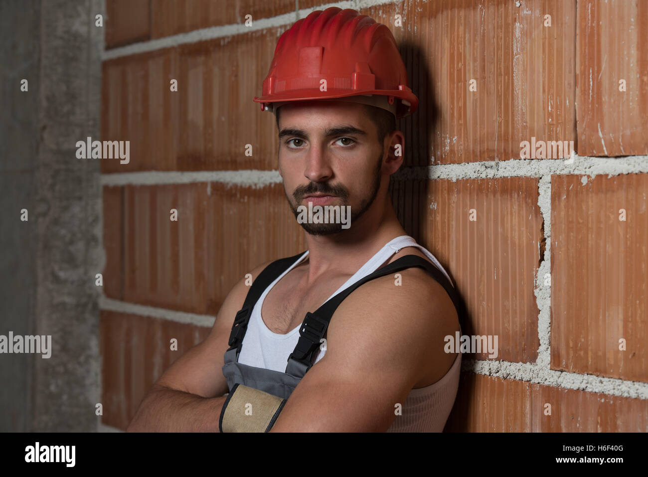 Portrait Of Handsome Male Architect Engineer With Red Helmet Stock ...
