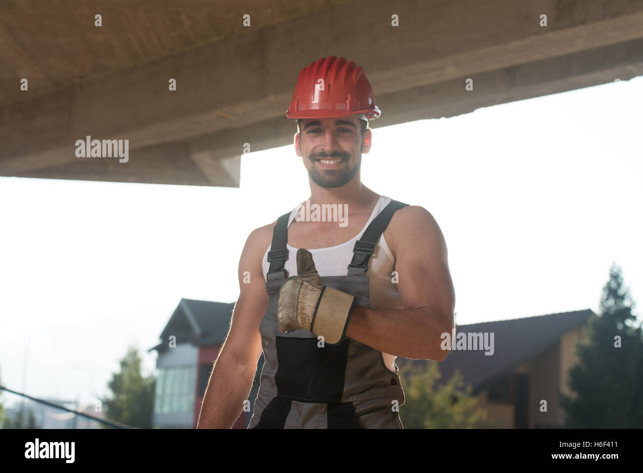 Portrait Of A Construction Worker With Red Helmet Making Thumbs Up Sign ...