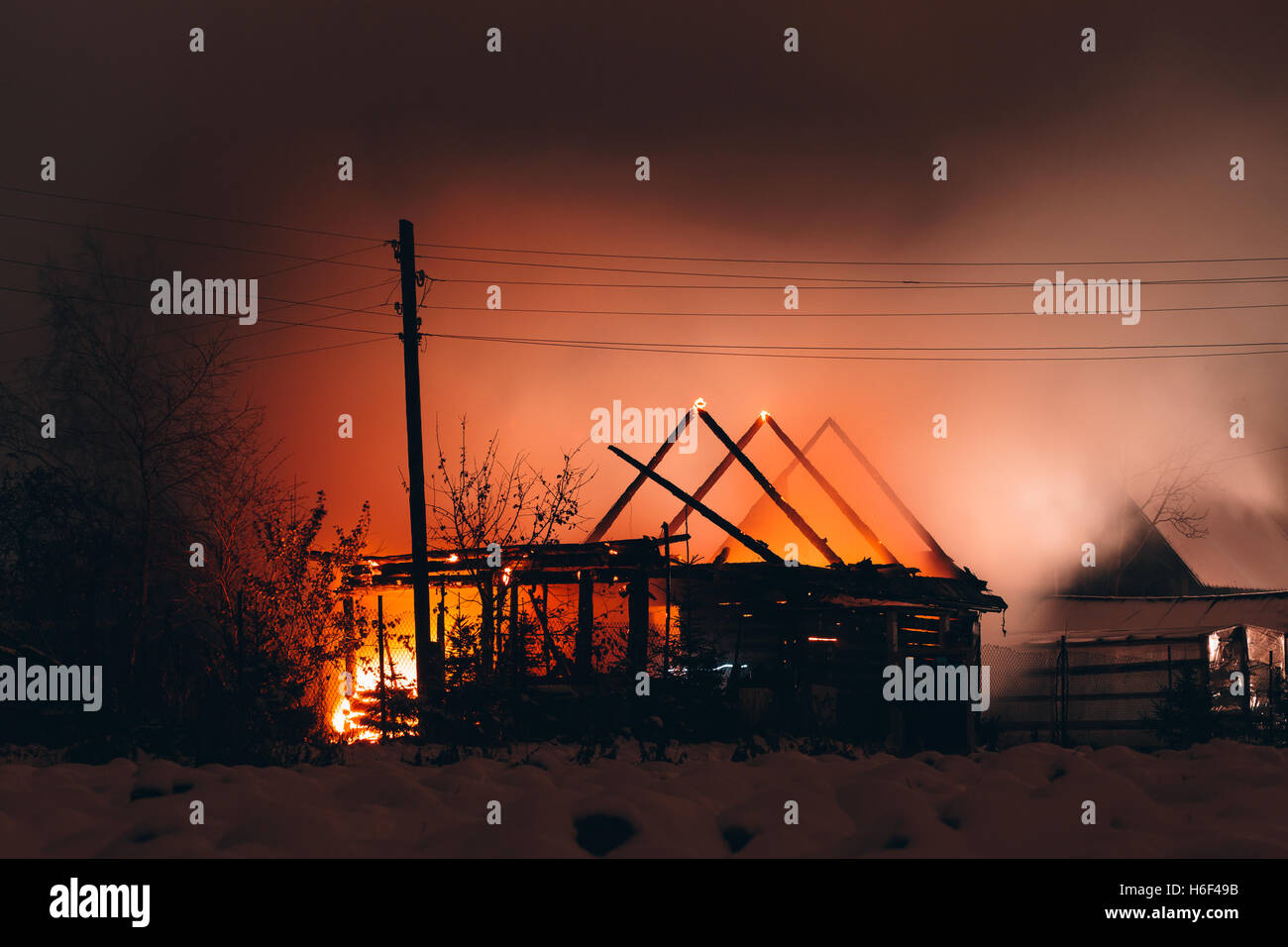 fire in a wooden house at night Stock Photo - Alamy