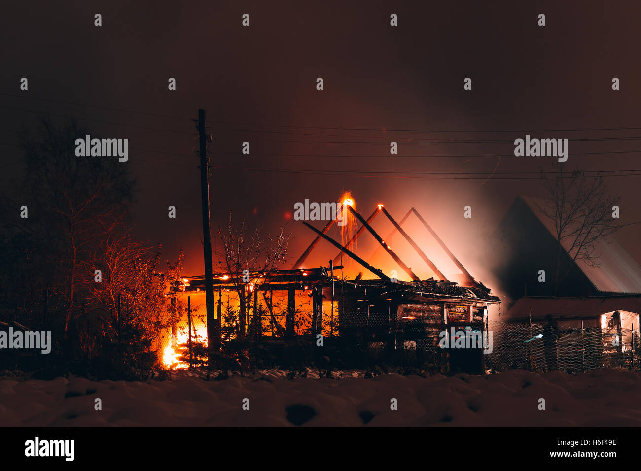 fire in a wooden house at night Stock Photo - Alamy