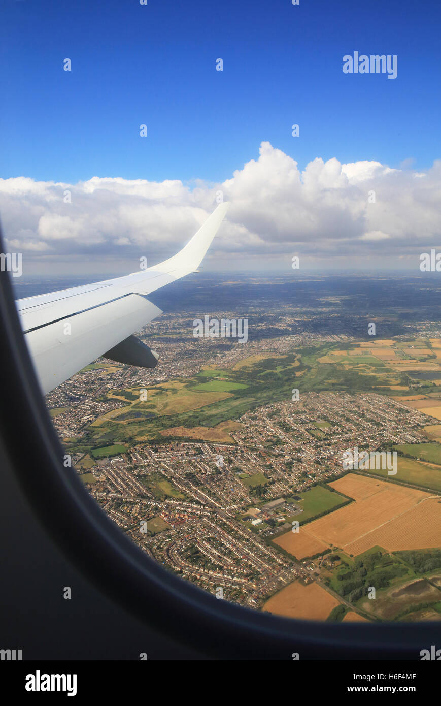View from the plane window, flying up the Thames estuary to London City ...