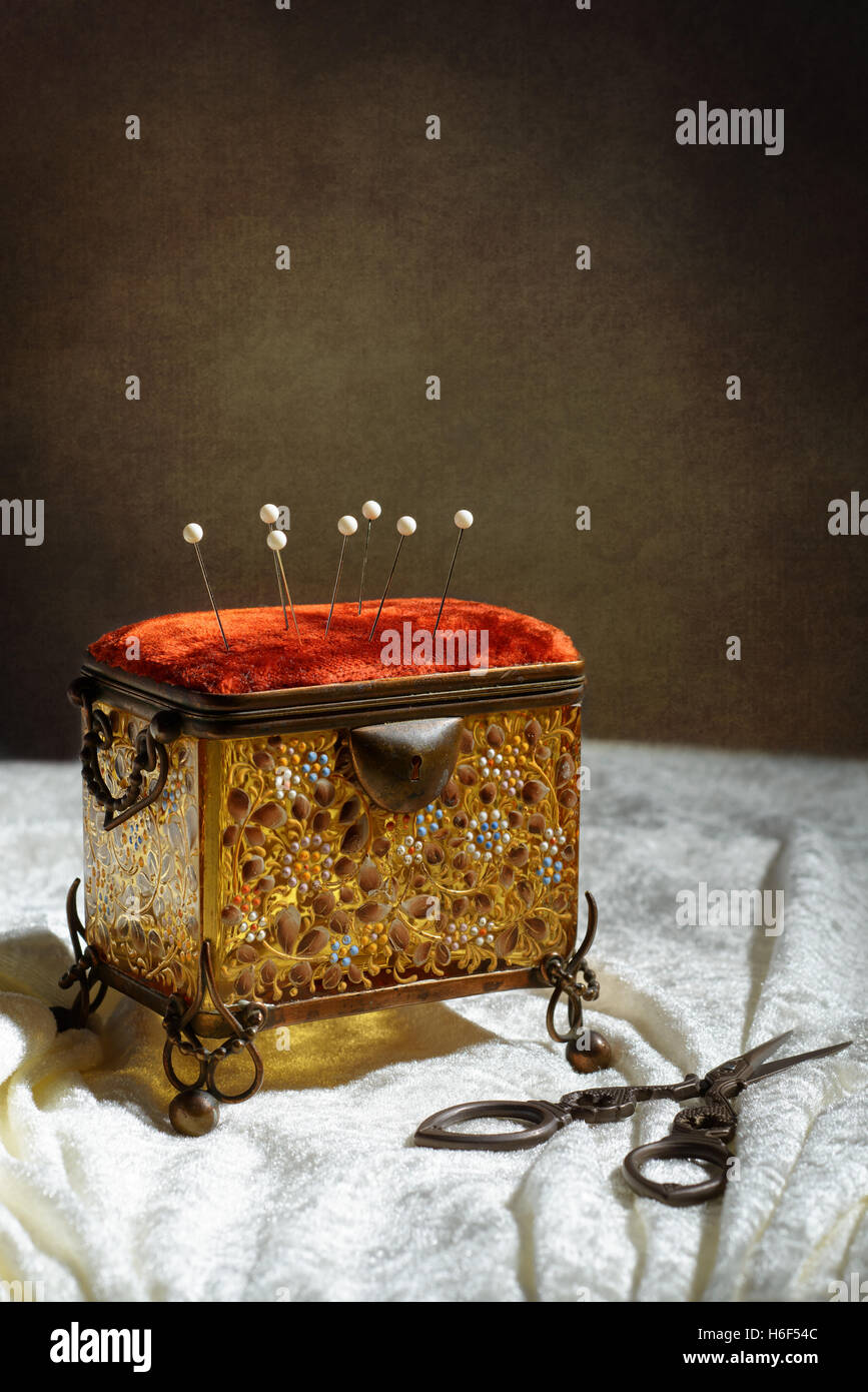 Antique sewing box with scissors and fabric Stock Photo - Alamy