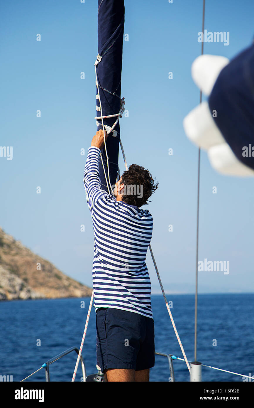 Man on yacht tying hi-res stock photography and images - Alamy
