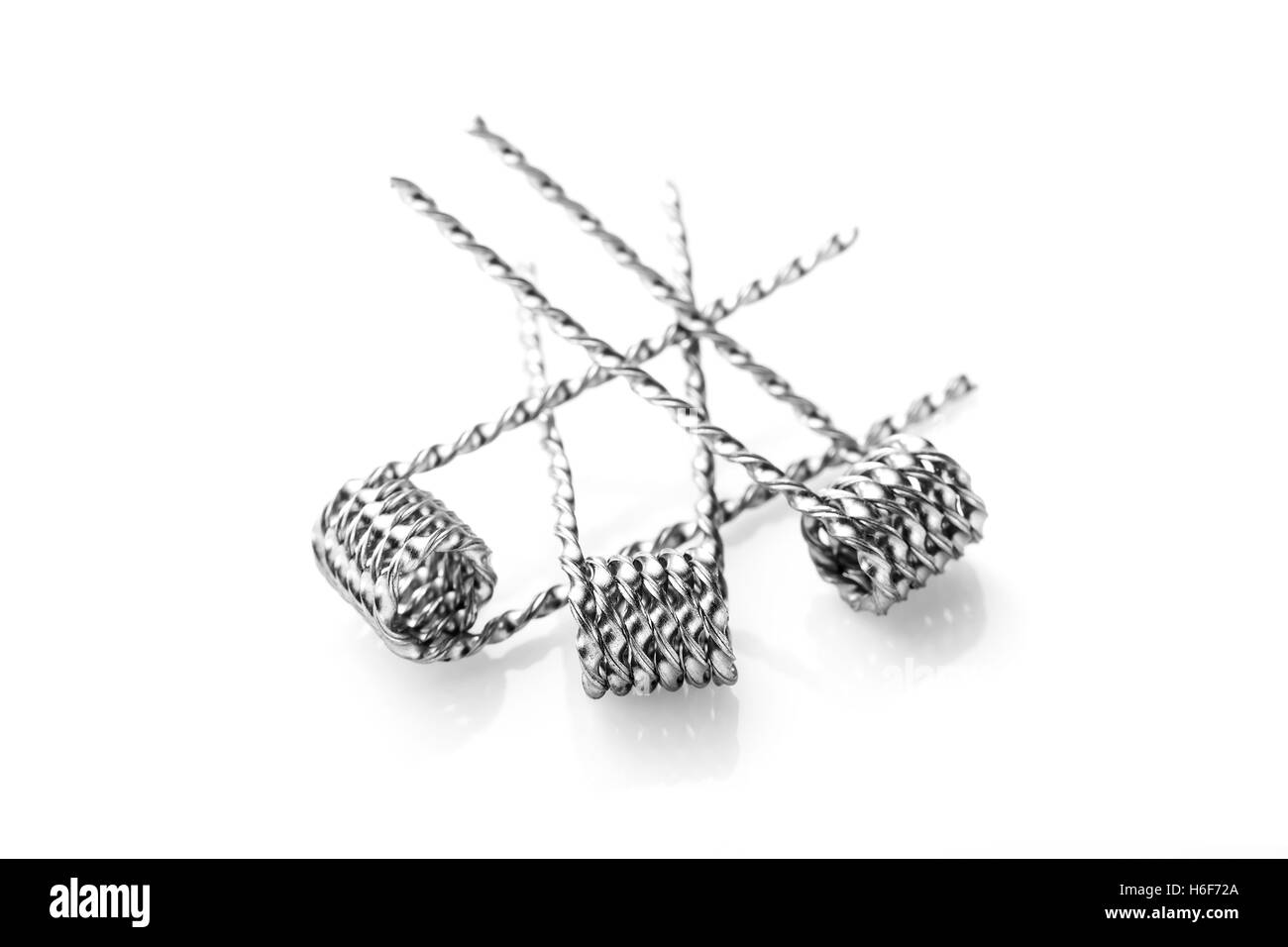 Ribbon twist coils for vaping on a white background macro closeup wire ...