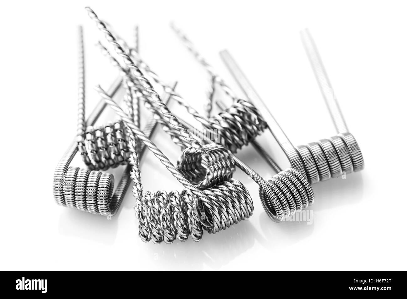 Mix coils for vaping on a white background macro closeup wire steel ...