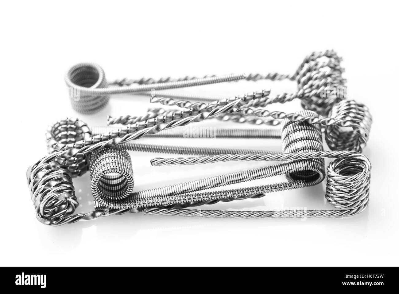Mix coils for vaping on a white background macro closeup wire steel ...