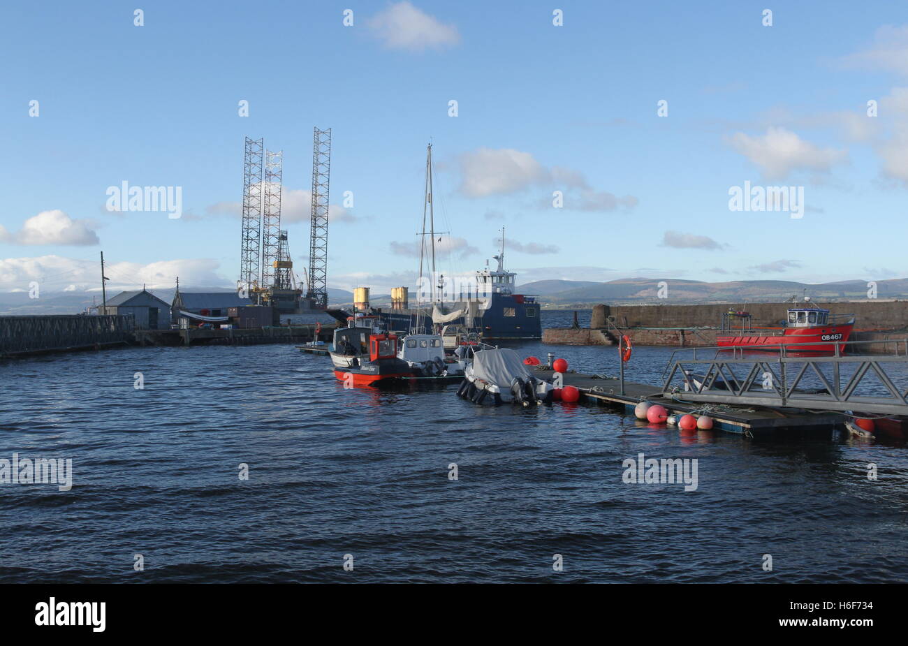 Nigg ferry in Cromarty harbour with oil rig Scotland November 2013 ...