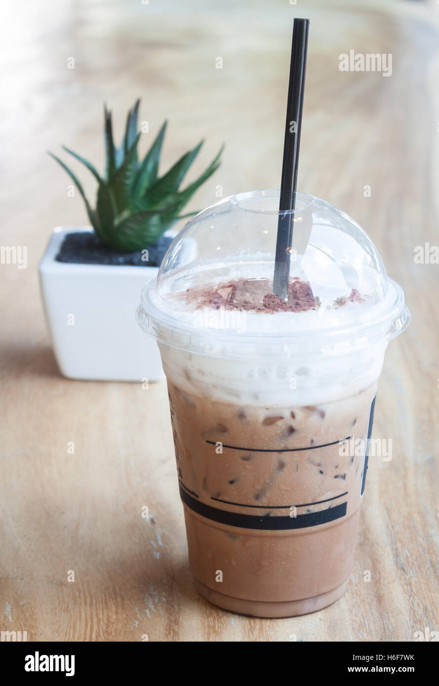 Iced coffee with green plant background, stock photo Stock Photo - Alamy
