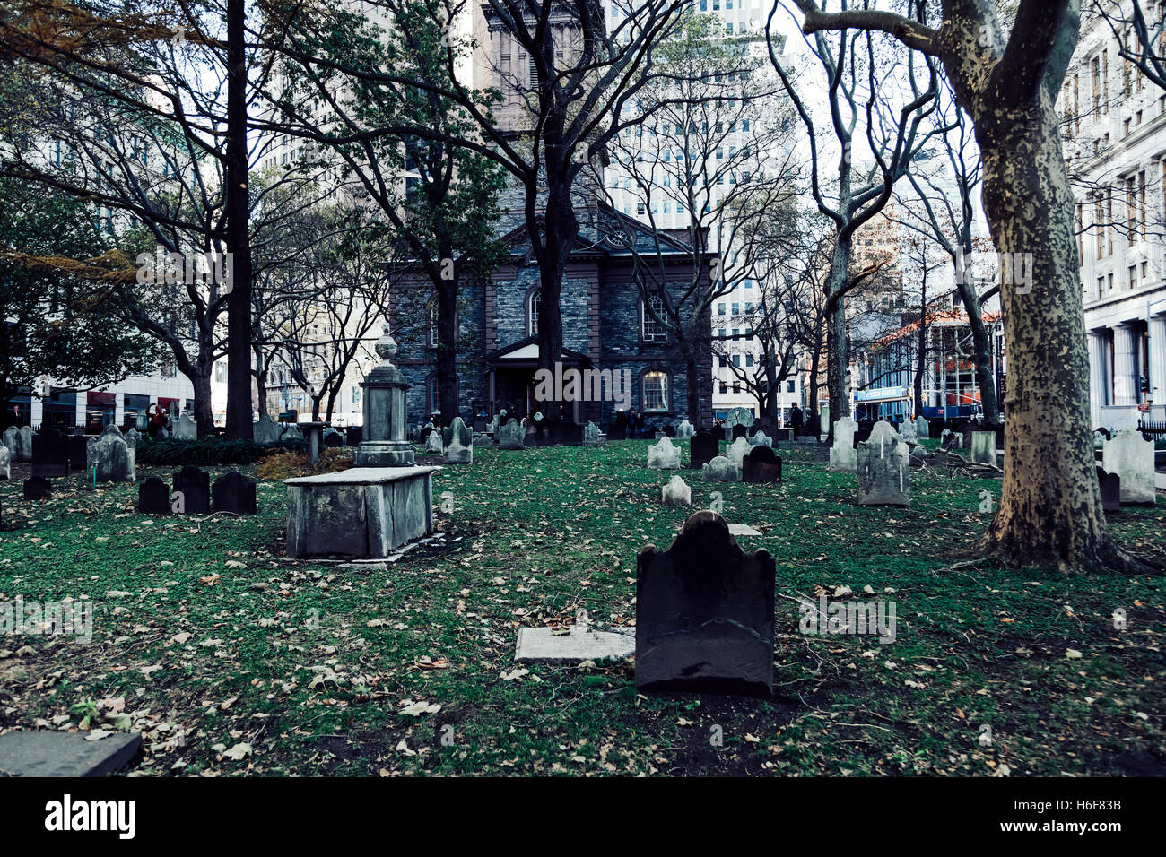 Tombstones in a graveyard by a church Stock Photo - Alamy