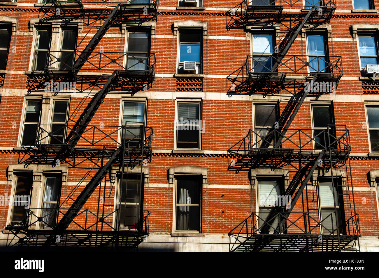 The exterior of a red stone residential building in Manhattan Stock ...