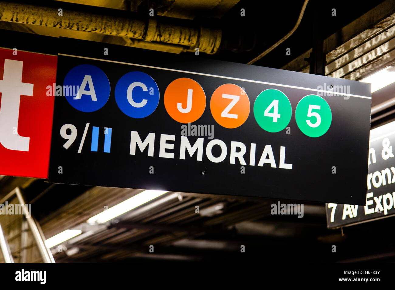 Sign in a New-York subway station marking the way to various lines and ...