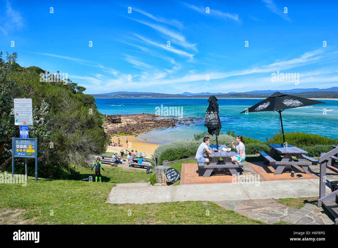 Couple sat at the Bar Beach Kiosk, Merimbula, New South Wales, NSW ...