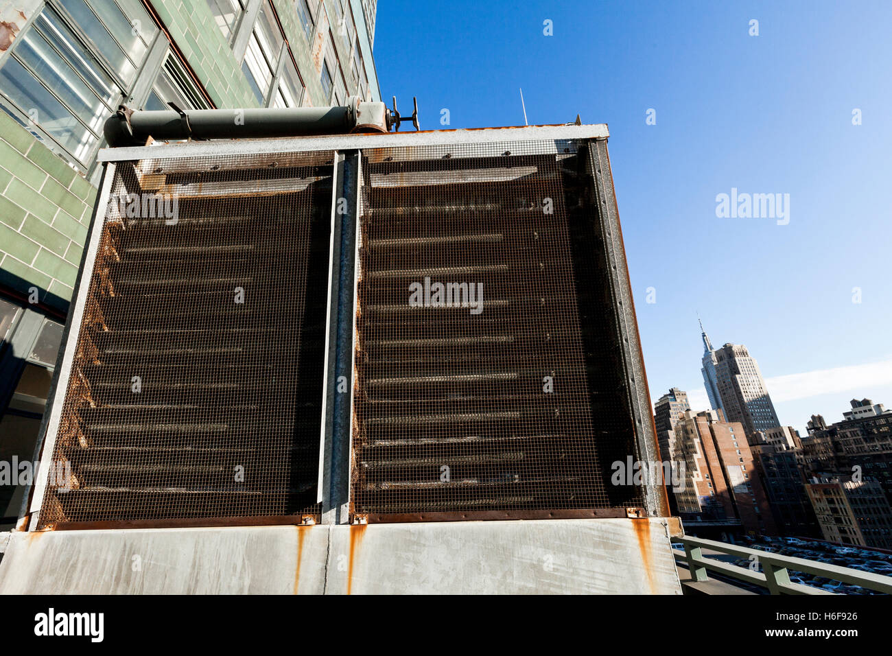 Wide angle view of an outdoor HVAC air conditioner unit located on a ...