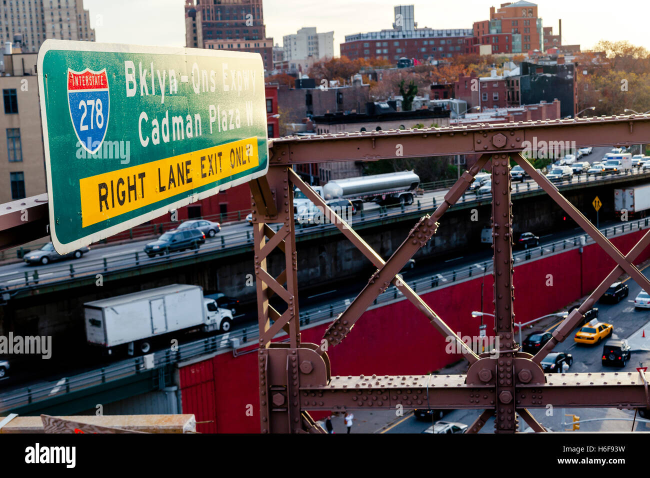 Sign above a highway depicting the way to the Brooklyn-Queens ...