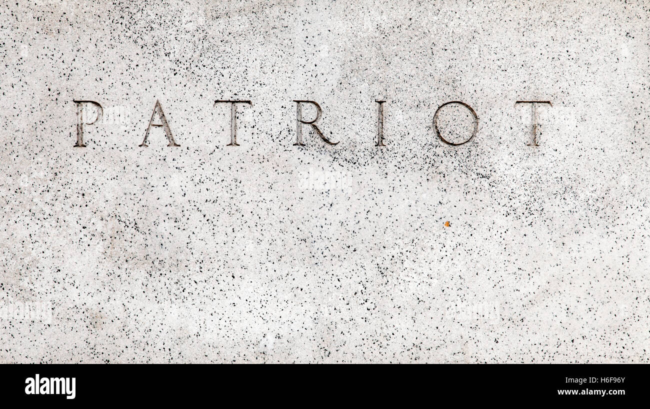The word "Patriot" engraved in stone wall Stock Photo - Alamy