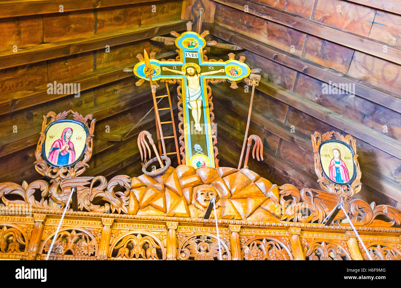The wooden iconostasis in Church of Apostles Peter and Paul decorated with carved and painted ...
