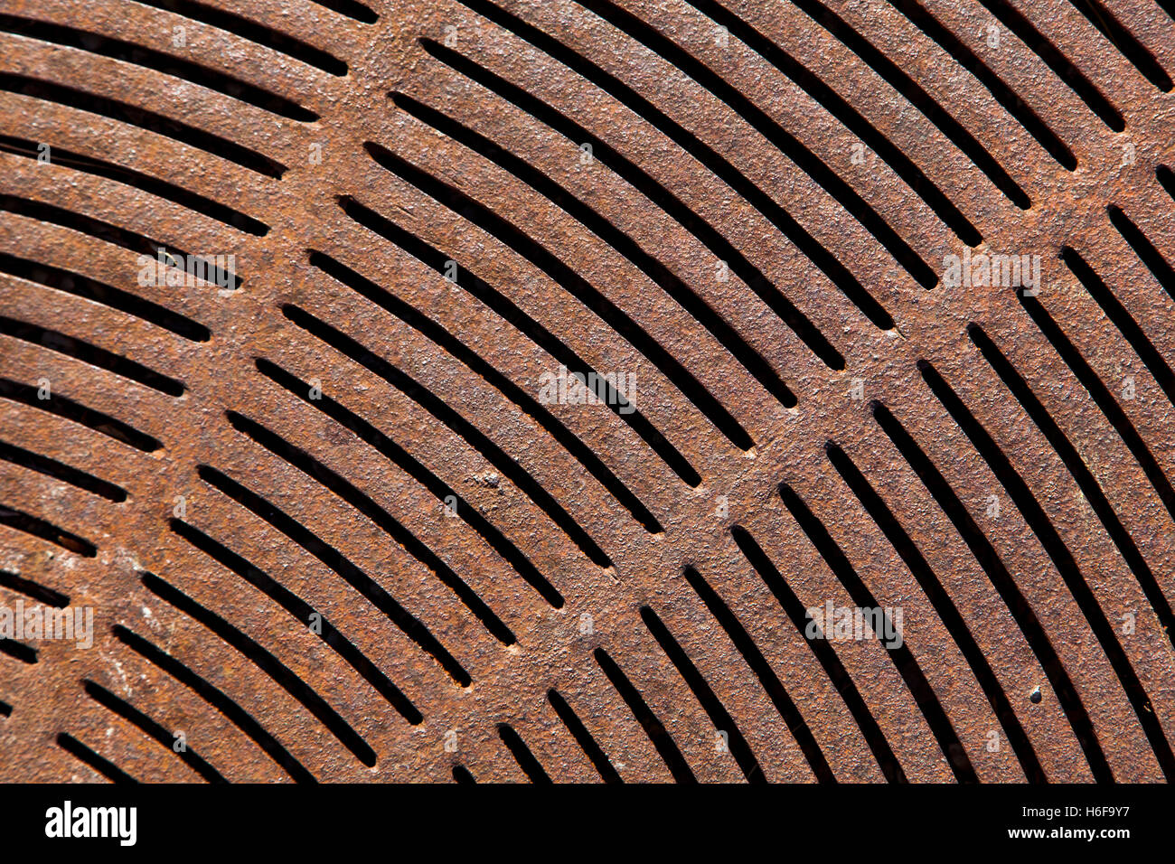 Abstract view of a circular rusty metal grate Stock Photo - Alamy
