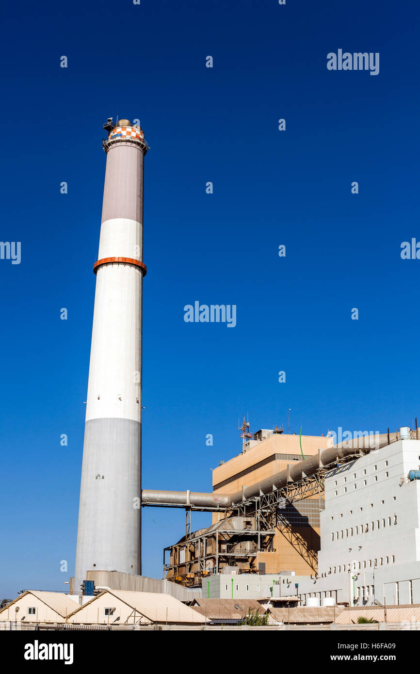 Fossil fuel power plant on a sunny day against clear sky Stock Photo ...