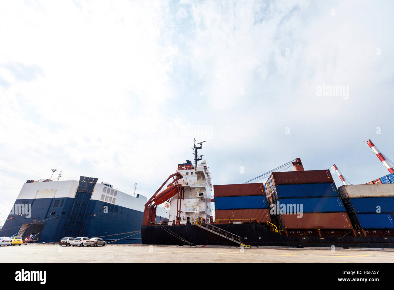 Docking freighter ships in a commercial harbor Stock Photo - Alamy