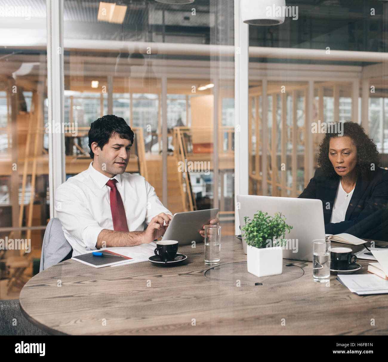 Focused diverse male female colleague hi-res stock photography and ...