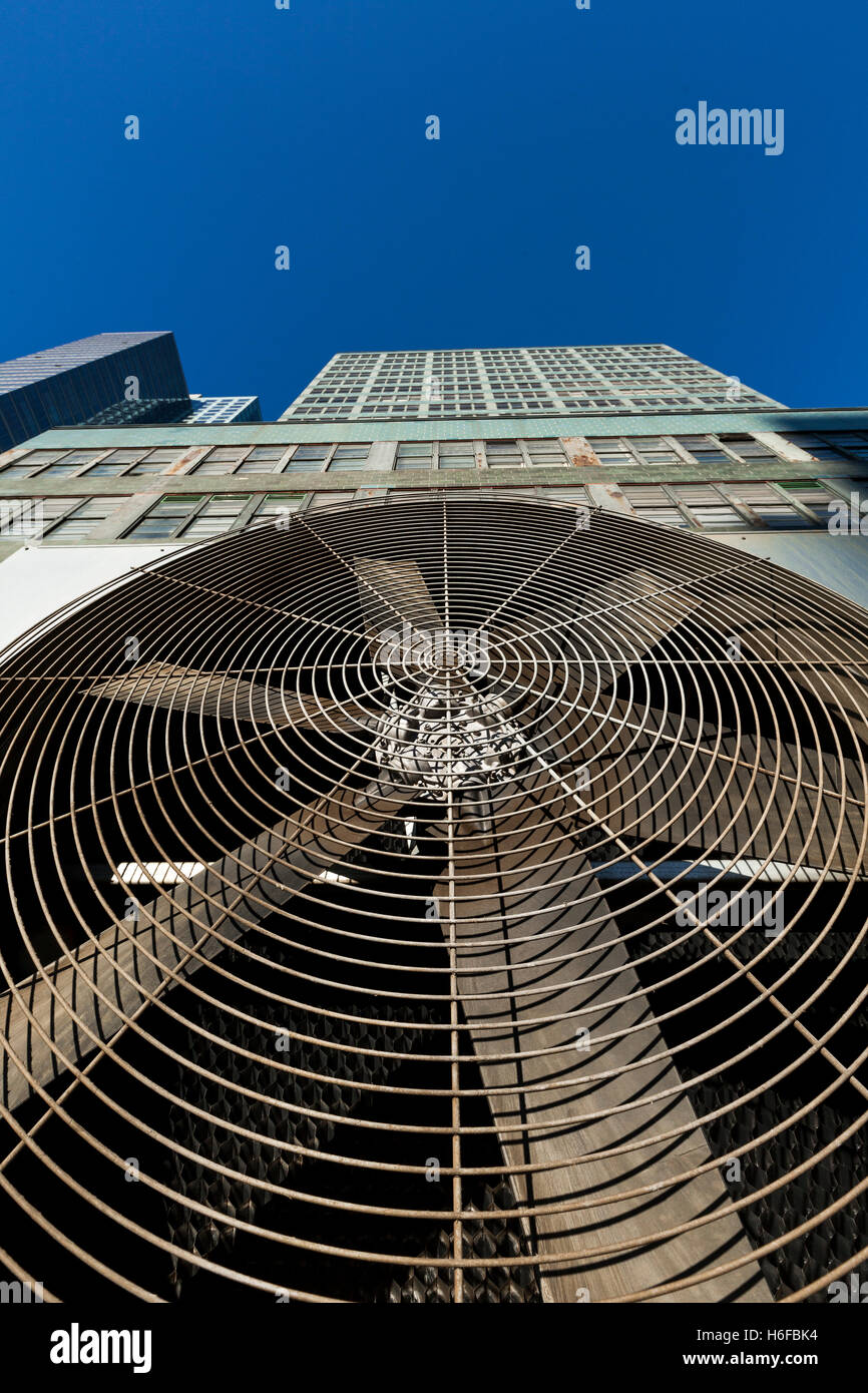 Wide angle view of an outdoor HVAC air conditioner unit located on a ...