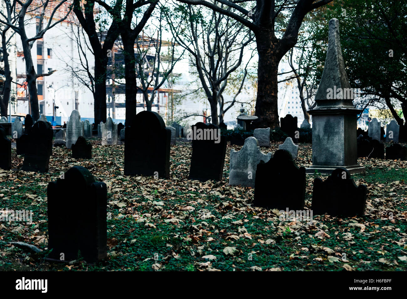 Tombstones in a graveyard by a church Stock Photo - Alamy