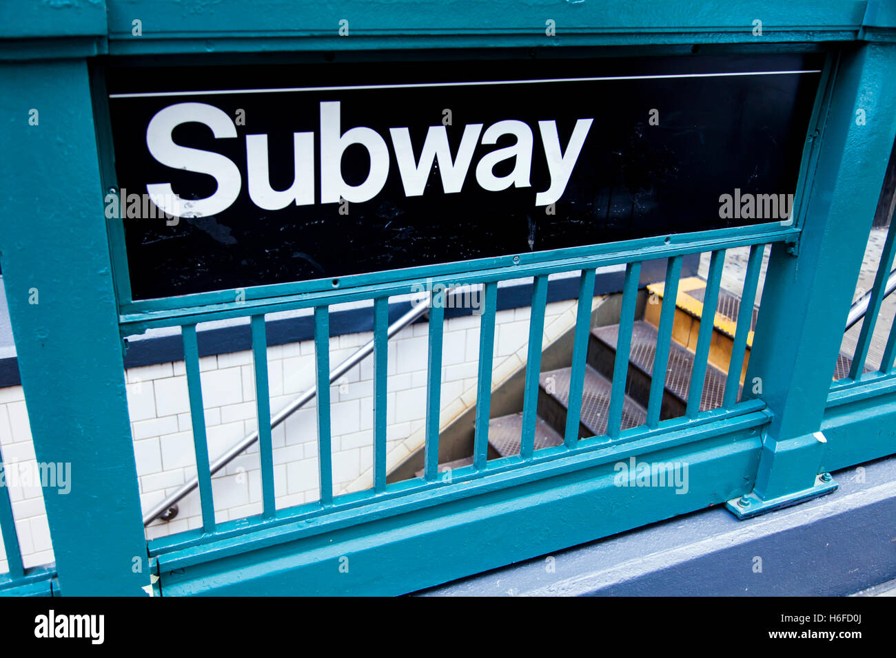 Sign depicting that the staircase behind it is an entrance to a subway ...