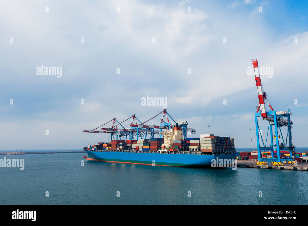 A freighter docking in a commercial harbor Stock Photo - Alamy