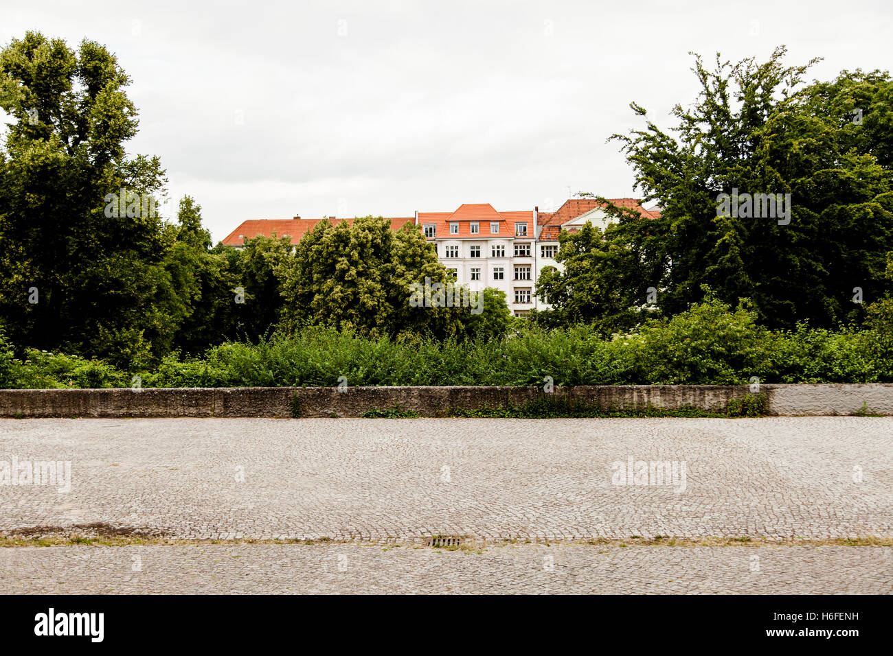 A European apartment building seen between the trees Stock Photo - Alamy