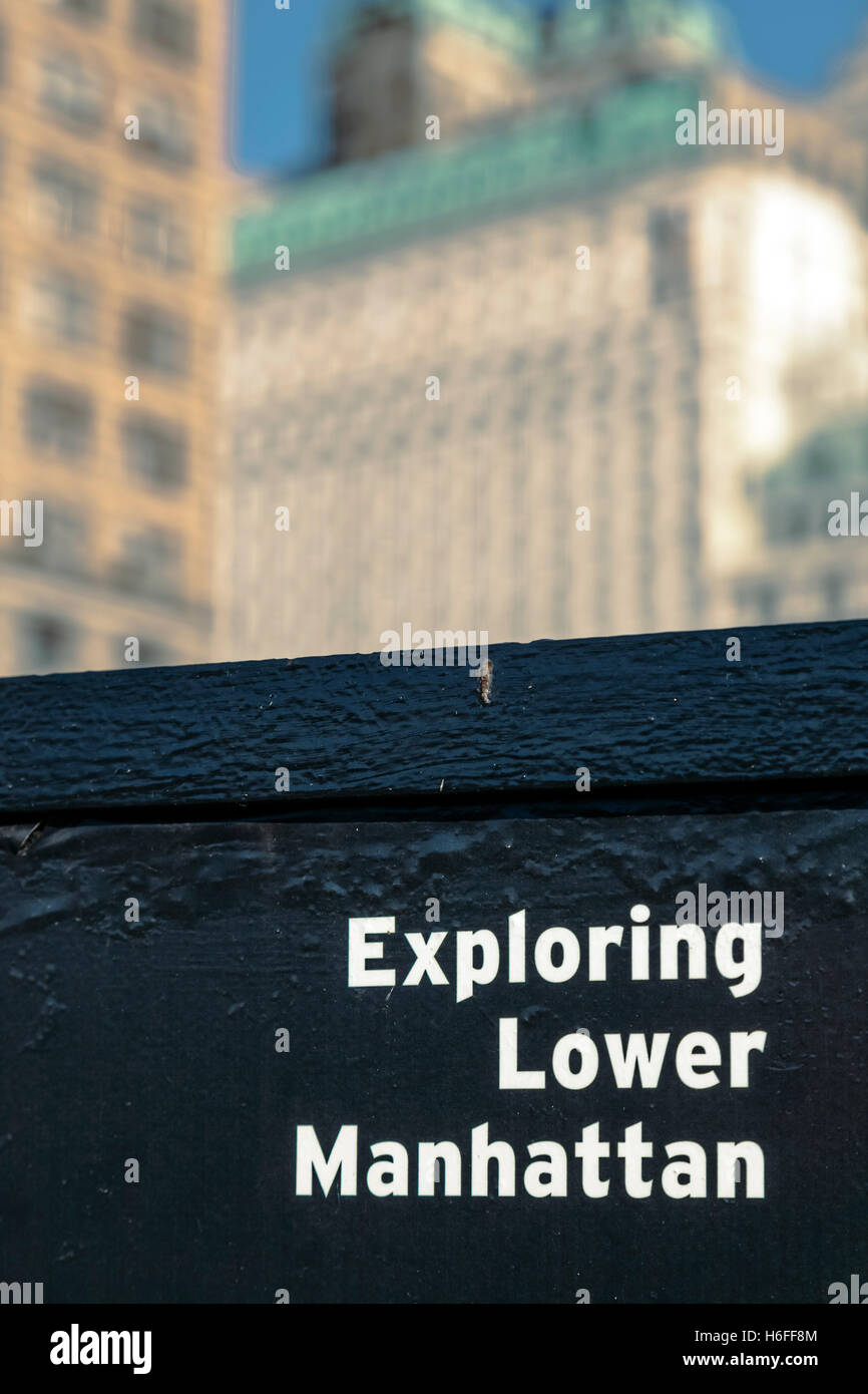 Exploring Lower Manhattan street sign with Lower Manhattan buildings in ...