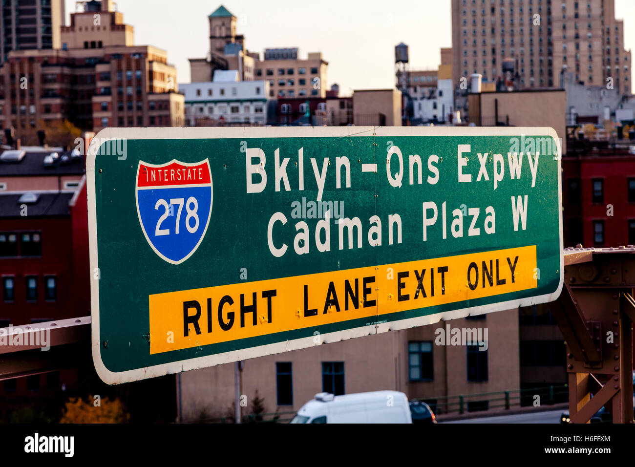 Sign above a highway depicting the way to the Brooklyn-Queens ...